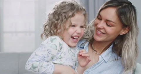 Close up of carefree mother and cute sma... | Stock Video | Pond5