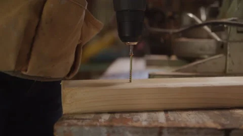 Close up of Carpenter Putting Screw in W... | Stock Video | Pond5