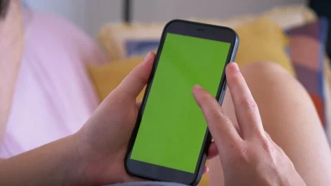 Close-up Caucasian hand scroll on green ... | Stock Video | Pond5