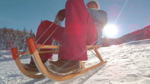 CLOSE UP: Cheerful female tourist sleds ... | Stock Video | Pond5