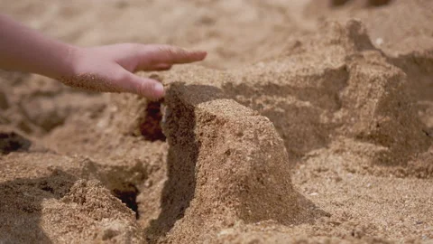 Close up of child hand playing with sand... | Stock Video | Pond5