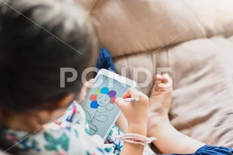 Close up Children little girl are drawing in smartphones learning and ...
