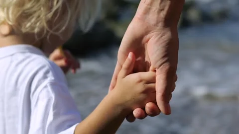 Close-up of children's and adult hands. ... | Stock Video | Pond5