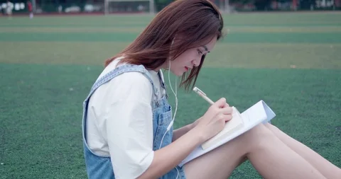 close up of a Chinese girl studying on t... | Stock Video | Pond5