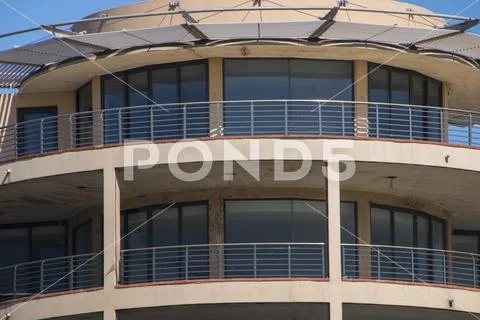 Close up of Circular Architecture of Tall Building Stock Image #126484771