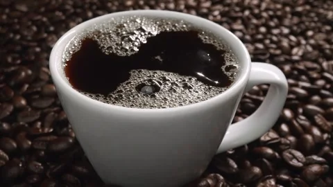 Close up of coffee bean drop in to hot e... | Stock Video | Pond5
