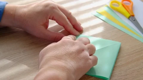 close-up of colored paper, female hands ... | Stock Video | Pond5