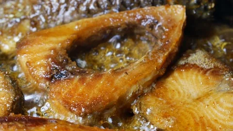 close up of cooking ilsha fish in a coop... | Stock Video | Pond5