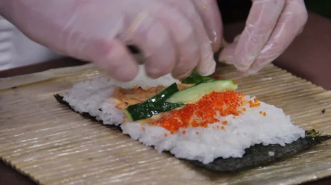 Close-up cook's hands making sushi roll ... | Stock Video | Pond5
