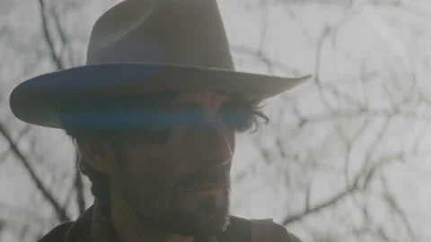 Close-up of a cowboy looking around to f... | Stock Video | Pond5