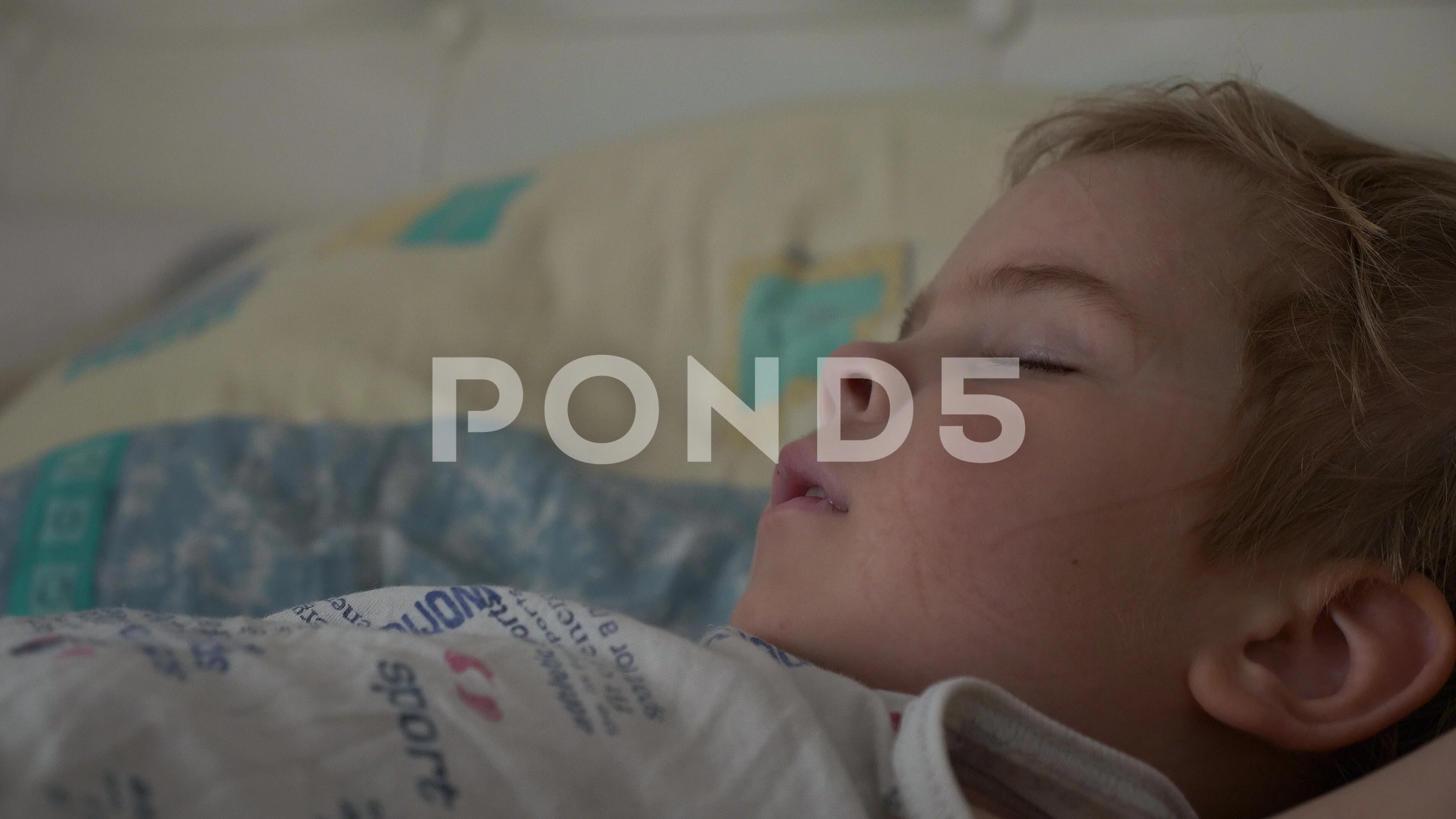 Boy Sleeping In Bed