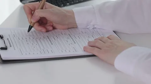 close-up doctor hands filling in writing... | Stock Video | Pond5