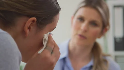 Close Up Of Doctor Talking To Crying Tee... | Stock Video | Pond5