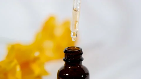 Close up of drops of essential oil falls... | Stock Video | Pond5