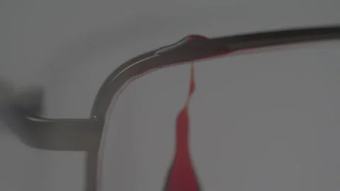 Close up of drops of red blood dripping ... | Stock Video | Pond5