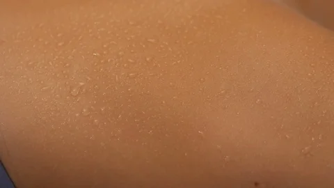 Close-up drops of sweat flowing on femal... | Stock Video | Pond5