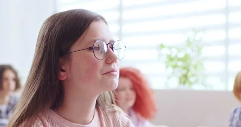 Close up of face of cute teen clever sch... | Stock Video | Pond5