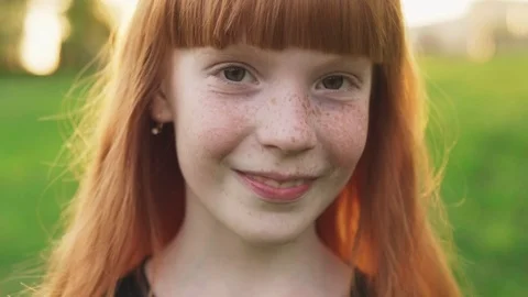 Close-up face of happy ginger girl with ... | Stock Video | Pond5