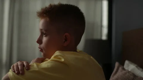 Close-up face of sad unhappy boy hugging... | Stock Video | Pond5