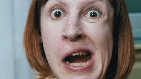 Close-up Facial Expressions of a Crazy W... | Stock Video | Pond5