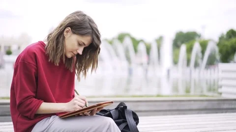 Close up of a fair hair girl in red draw... | Stock Video | Pond5