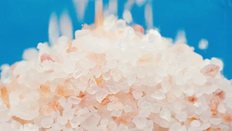 Close-up of falling down salt into glass... | Stock Video | Pond5