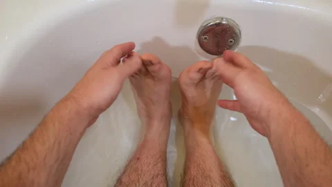 Close up of feet being soaked in water w... | Stock Video | Pond5