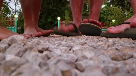 Close up of feet in sandals. Wiggling to... | Stock Video | Pond5