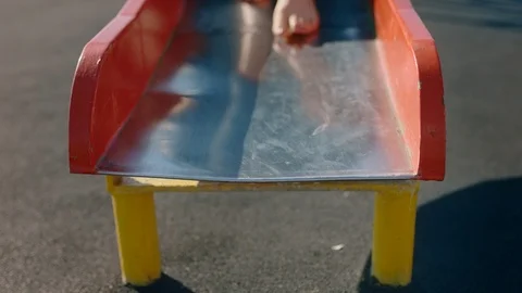 close up feet woman sliding on playgroun... | Stock Video | Pond5