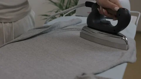 Close up of female hands ironing clothes... | Stock Video | Pond5