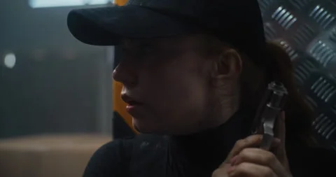 Close Up of Female Secret Agent Hiding B... | Stock Video | Pond5