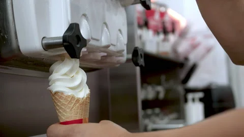 Close-up filling of wafer cup with ice c... | Stock Video | Pond5