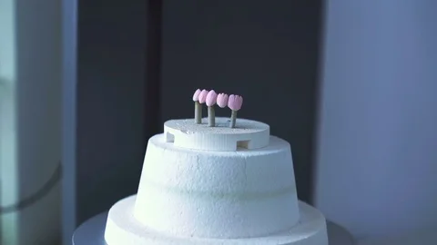 Close up of a firing tooth crowns in an ... | Stock Video | Pond5