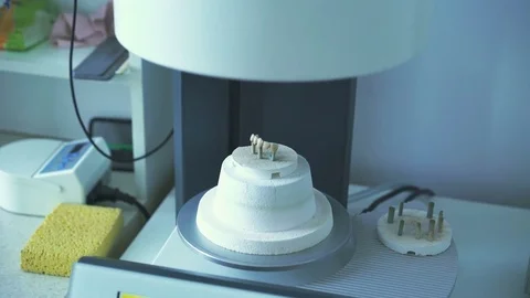 Close up of a firing tooth crowns in an ... | Stock Video | Pond5