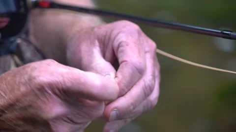 Close Up Fisherman Hands Tying On New Fl... | Stock Video | Pond5