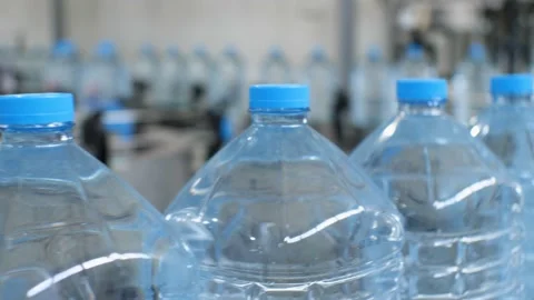 Close-up of five-liter water bottles mov... | Stock Video | Pond5