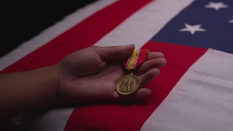 Close Footage of a Hand Holding a War Me... | Stock Video | Pond5