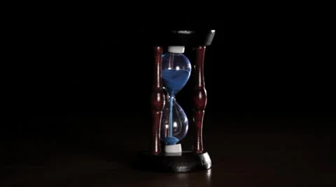 Close up footage of sand time on black b... | Stock Video | Pond5