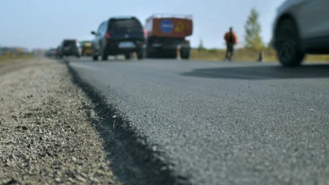 Close-up of a freshly laid asphalt road.... | Stock Video | Pond5