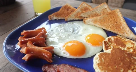Close up fried unhealthy breakfast On bi... | Stock Video | Pond5