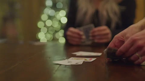 Close up of Friends Playing Cards Around... | Stock Video | Pond5