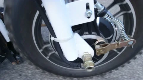 Close up of a front motor wheel spinning... | Stock Video | Pond5