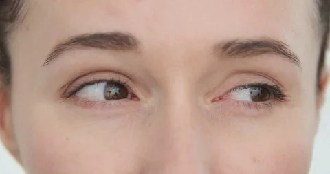 Close up, funny eyes running around. Wom... | Stock Video | Pond5