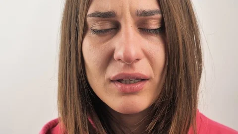 close-up girl crying on white background... | Stock Video | Pond5