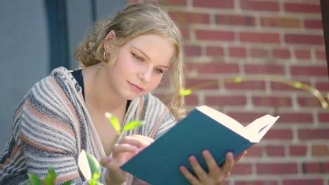 Close up of girl student reading a book ... | Stock Video | Pond5