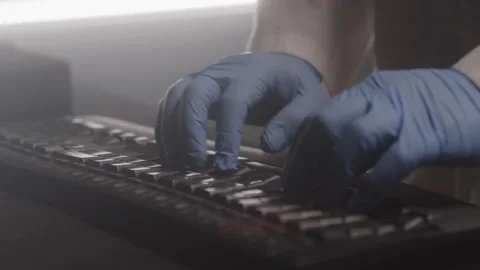 Close-up of Gloved Hands Typing on Compu... | Stock Video | Pond5