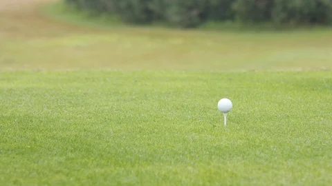 Close-up of a golf club making a tee sho... | Stock Video | Pond5