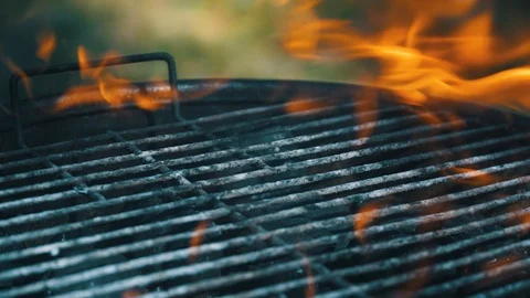 Close up of a grill with dancing hot fir... | Stock Video | Pond5