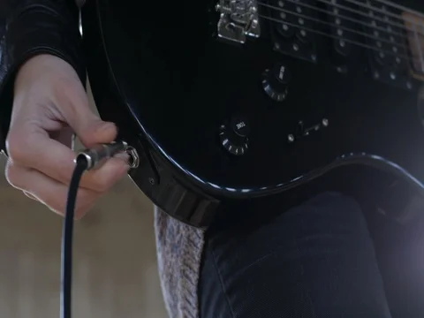 Close up of guitarist's hand plugging au... | Stock Video | Pond5
