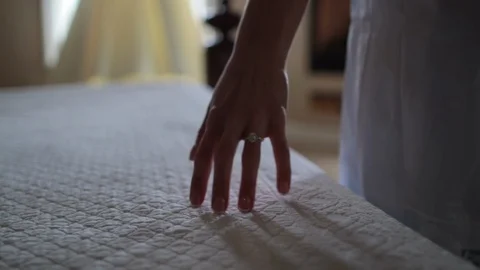 Close up of hand caressing bed towards d... | Stock Video | Pond5